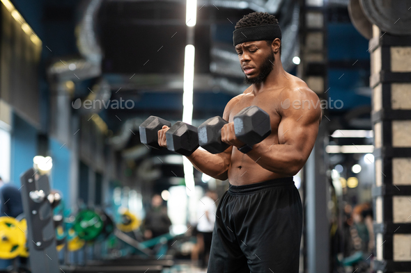 Handsome bodybuilder making work out with barbells at gym Stock Photo ...