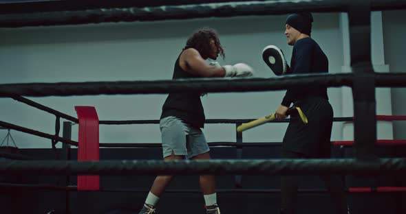 Coach is Training African Pugilist on Ring Using Boxing Stick and ...