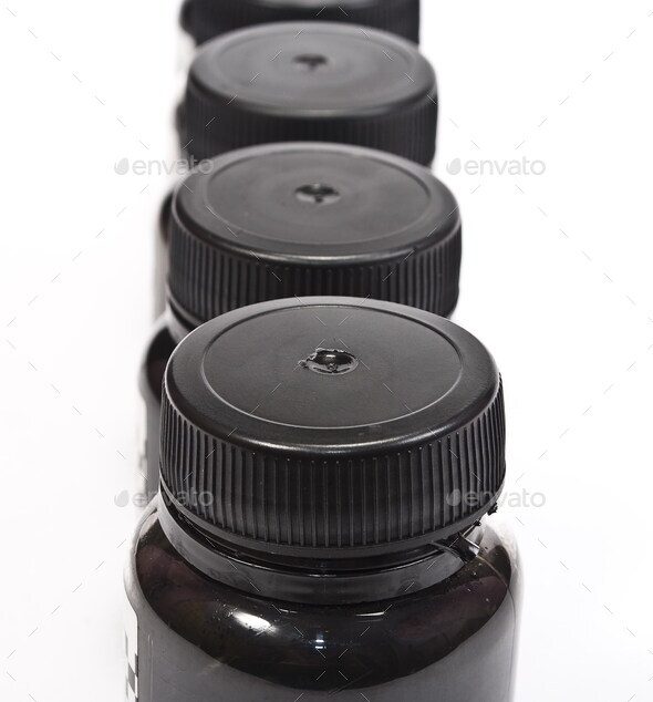 Black ink bottles Stock Photo by SeDmi | PhotoDune