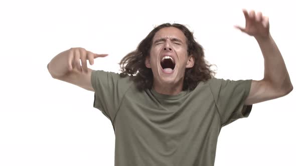 Video of Distressed Young Man in Tshirt Starting to Scream and Shake ...