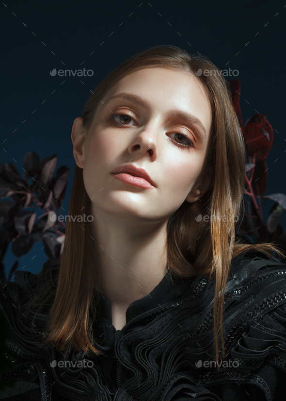 portrait of cuacasian pale young woman over dark background Stock Photo ...