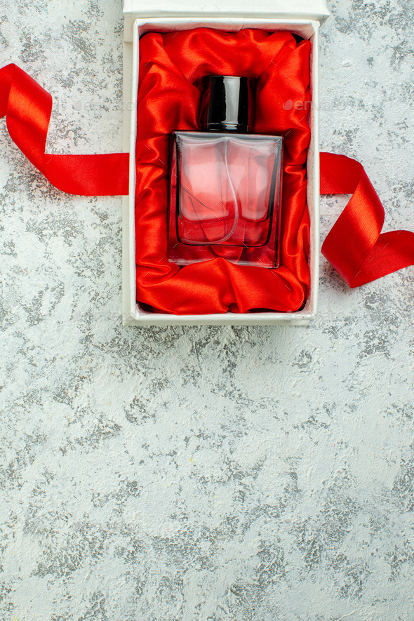 top view perfume bottle red ribbon Stock Photo by AydinovKamran | PhotoDune