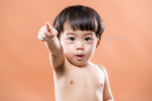 Cute boy pointing front Stock Photo by leungchopan | PhotoDune