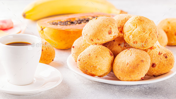 Traditional Brazilian breakfast - cheese bread, coffee, ripe fruit ...
