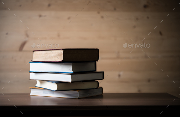 Stack of books on wooden table. Education concept. Stock Photo by ...