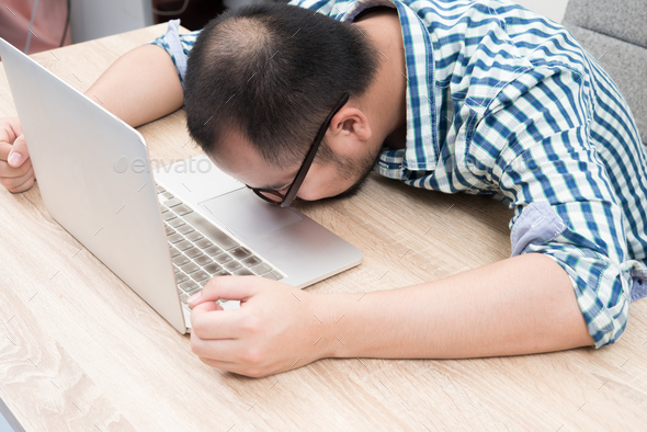 Businessman sitting behind table tired fall asleep at workplace ...