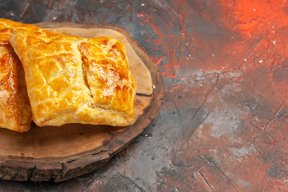 bottom view penovani khachapuri on wood board on dark red background ...