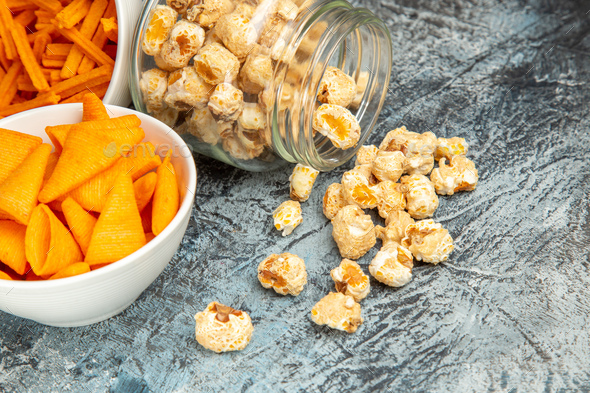 front view cheese rusks with cips and popcorn on a light background ...