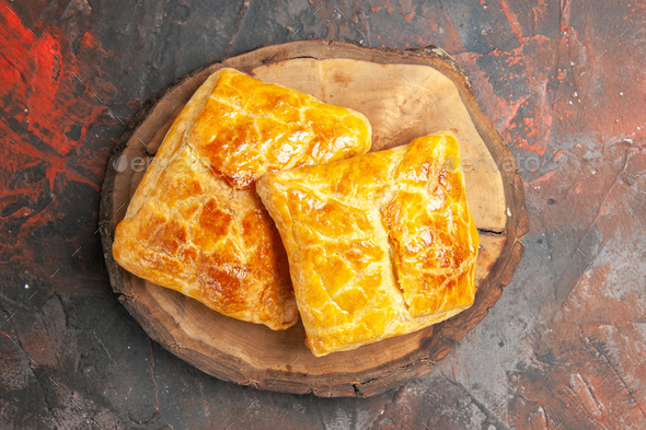 top view penovani khachapuri on wood board on dark red background Stock ...