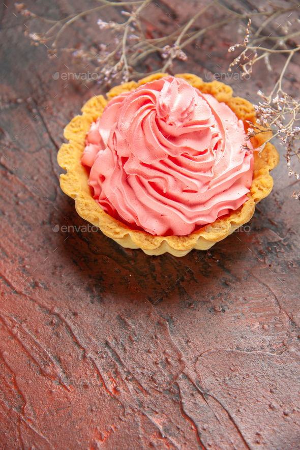 bottom view small tart with pink pastry cream on dark red table free ...