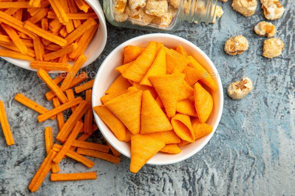 top view cheese rusks with cips and popcorn on light background cips ...