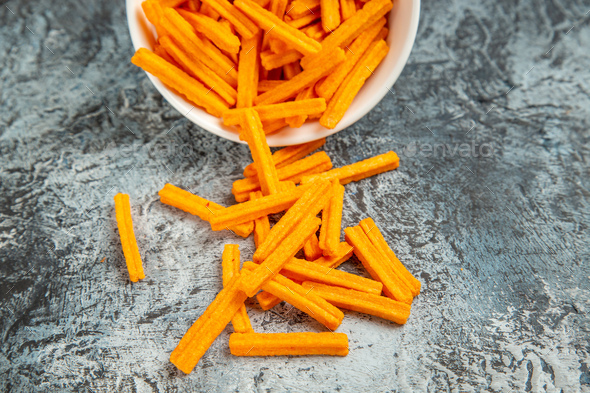 front view cheese rusks for movie inside plate on light background cips ...