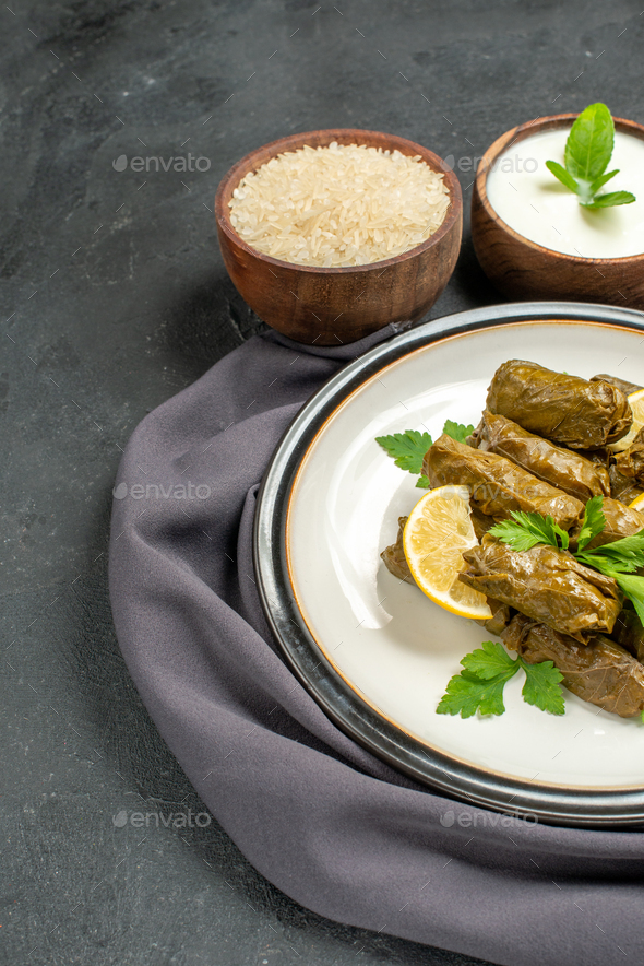 bottom view azerbaijani cuisine dolma in grape leaves on white plate ...