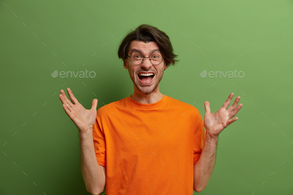 Angry disappointed man reacts emotionally on negative news, exclaims ...