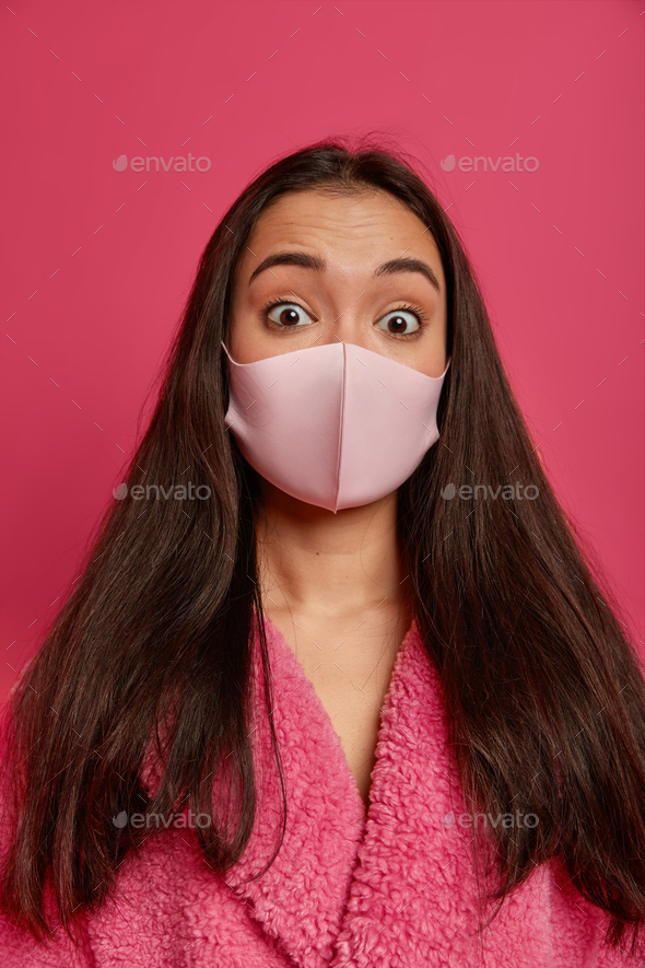 Shocked scared panic Asian woman wears respirator mask to protect ...