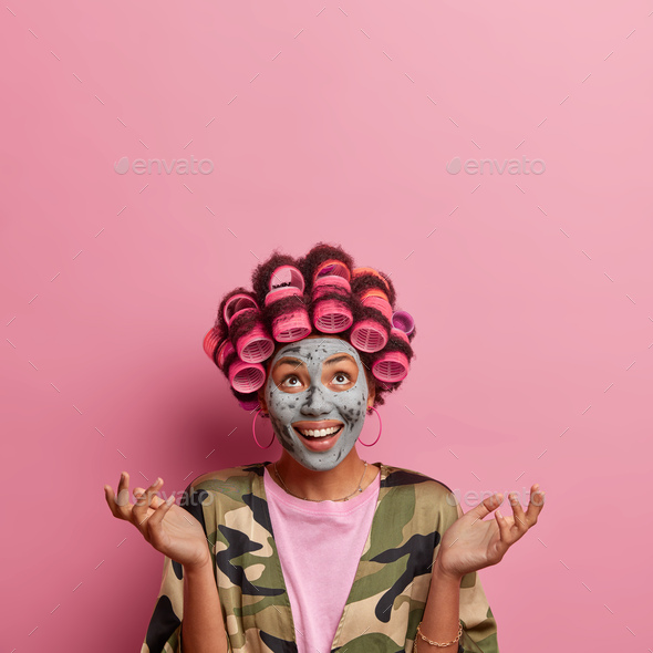 Beauty, spa treatment and hairstyling concept. Positive hesitant woman ...