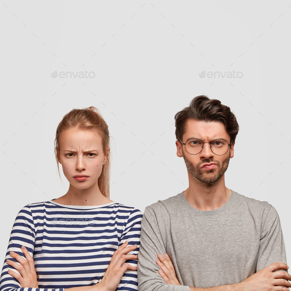 Negative human feeling concept. Dissatisfied female and male with arms ...