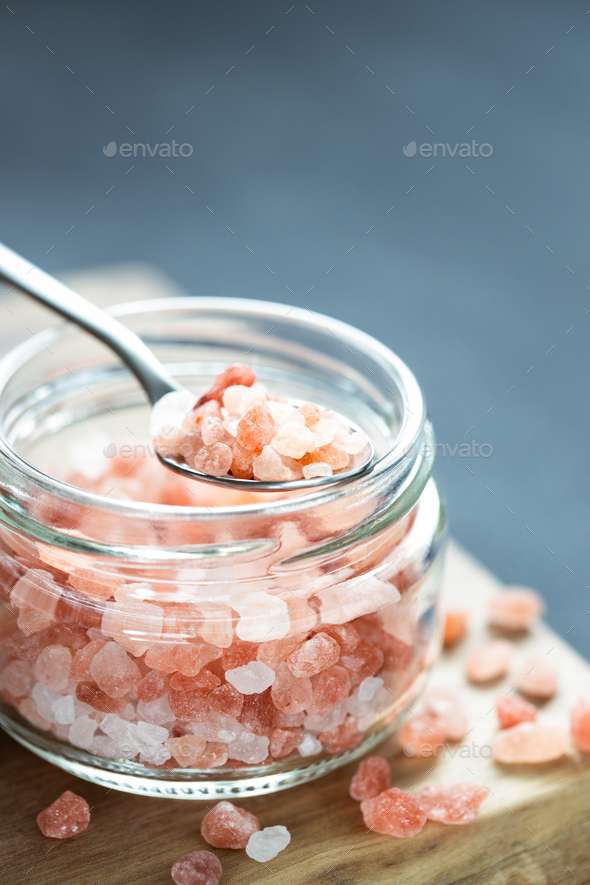 Himalayan Pink Salt in Spoon and Glass Jar. Stock Photo by fucsiya