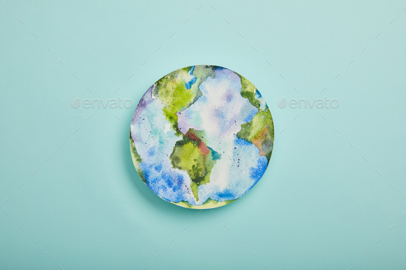 top view of planet picture on turquoise background, earth day concept ...