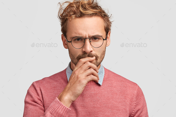 Discontent sad European male entrepreneur with sullen facial expression ...