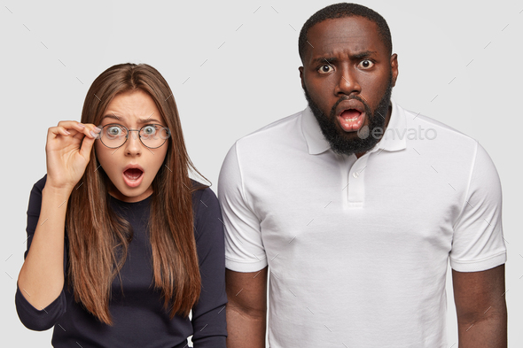 Photo of mixed race colleagues stare at camera: dark skinned guy and ...