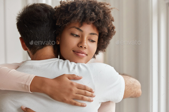 Romantic couple have warm hug indoor, support each other, express ...