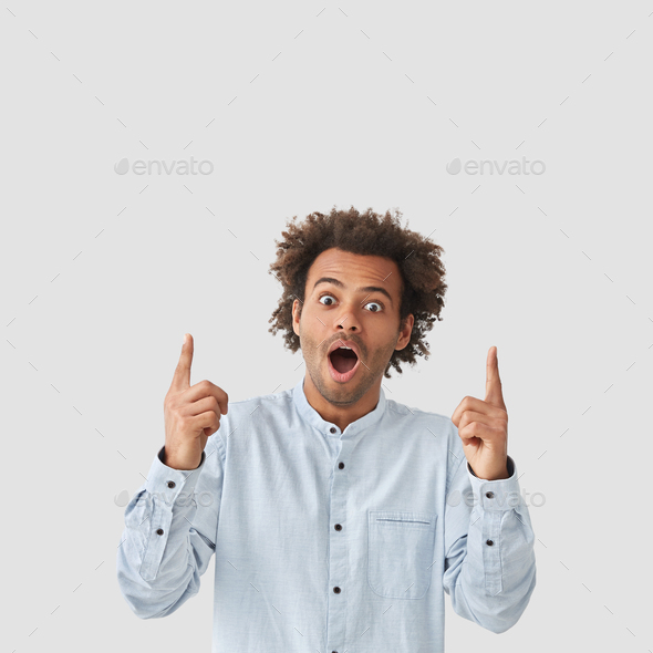 Omg concept. Emotive stupefied young African American male with stunned ...