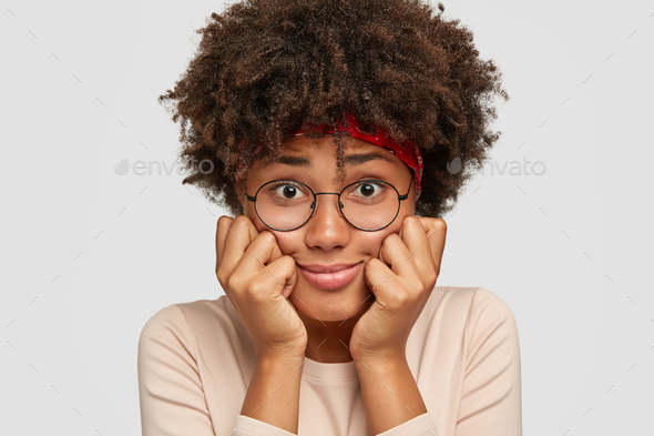 Close up shot of embarrassed black lady has surprised dejected facial ...