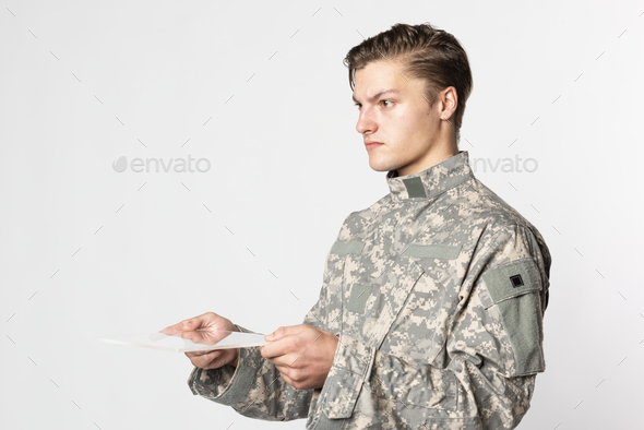 Military man using transparent tablet training military technology ...