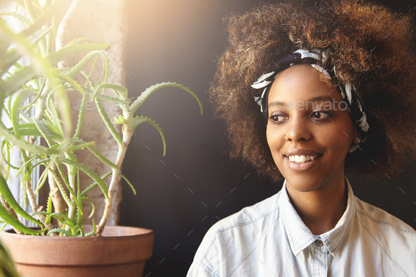 People and leisure. Charming young African female wearing do-rag and ...
