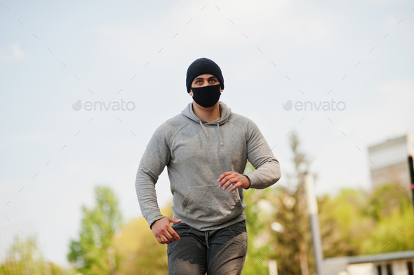 Sport arabian man in black medical face mask Stock Photo by ASphotostudio