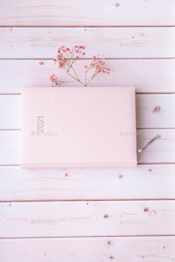 Diary pink organizer with cute pink dried flowers sign 2021 on white ...