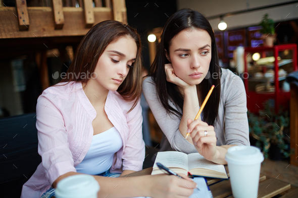 Learn after classes Stock Photo by Pressmaster | PhotoDune