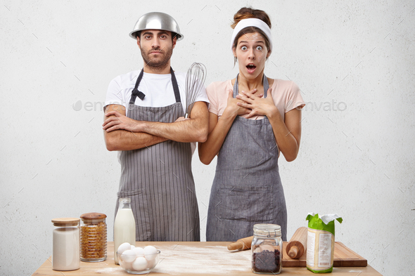 Hard working male and female cookers work in restaurant, cook various ...