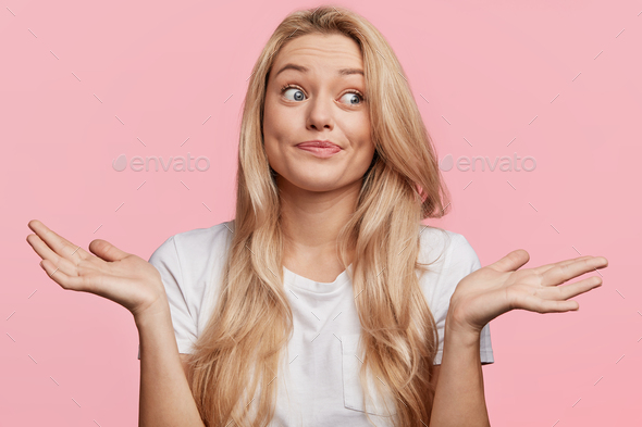 Human Emotions And Feeling Concept Hesitant Blonde Pretty Young Woman