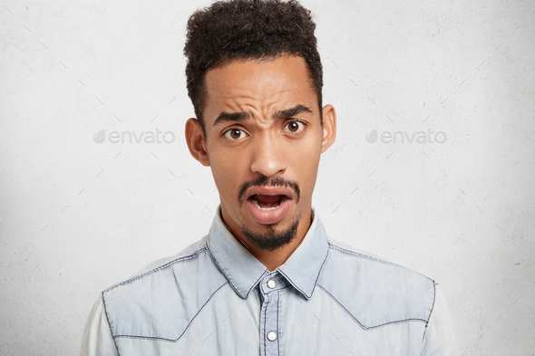 Negative emotions and body language concept. Unsatisfied black man ...