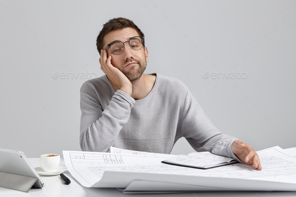 People, job, tiresome and overwork concept. Bored sleepy male engineer ...