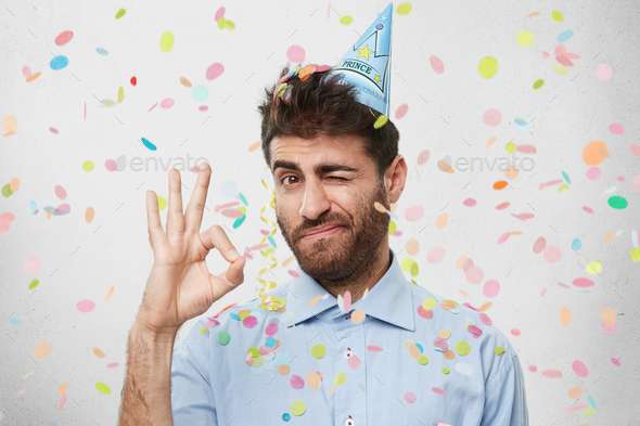 Body language concept. Portrait of good-looking young unshaven man ...