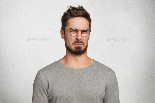 Negative human expressions and attitude. Angry dissatisfied male has ...