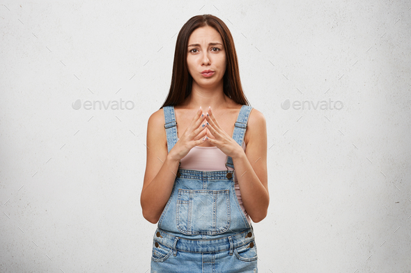 Indecisive girl feeling hesitant about making important decision ...