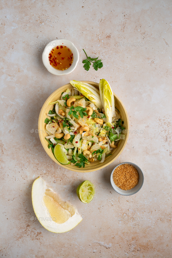 Top down view of a delicious vegan pomelo salad with chill lime ...
