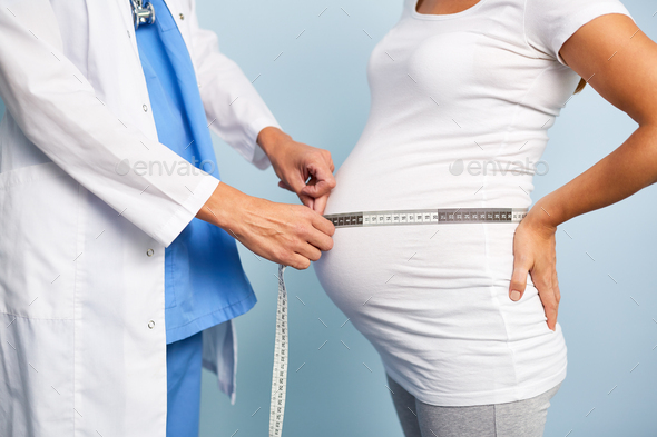 Measuring stomach Stock Photo by Pressmaster | PhotoDune