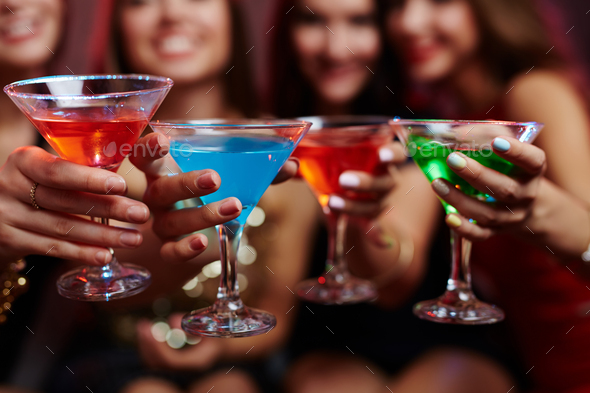 Cheering with cocktails Stock Photo by Pressmaster | PhotoDune