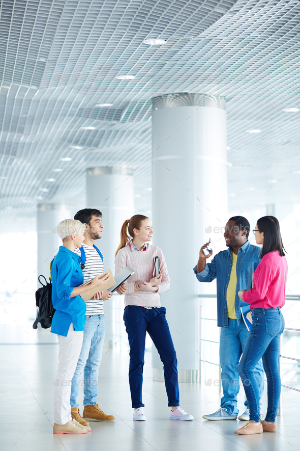 Conversation of students Stock Photo by Pressmaster | PhotoDune
