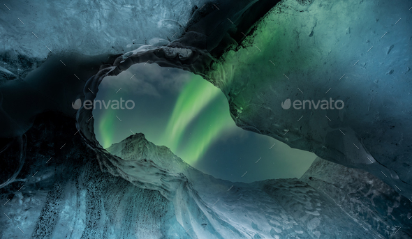 Northern lights aurora borealis over glacier ice cave. Stock Photo by ...