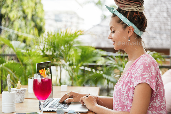 Fashionable female with dreadlocks hairstyle dressed casually ...