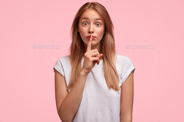 Body language concept. Beautiful surprised young female with shocked ...