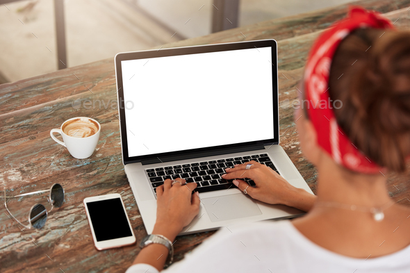 Back view of unrecognizable female model advertizes news and keyboards ...