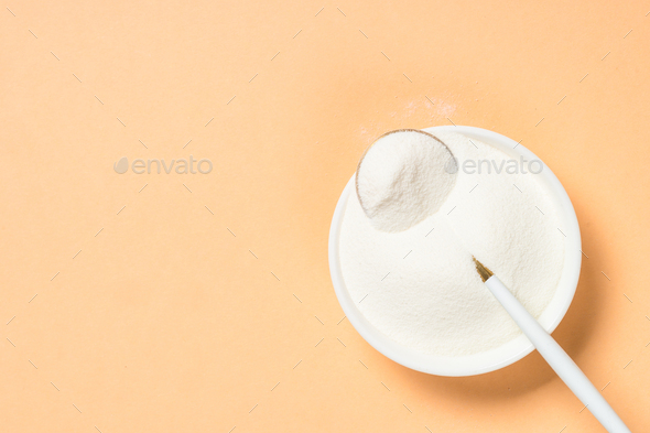 Collagen powder dietary supplement at blue. Stock Photo by Nadianb