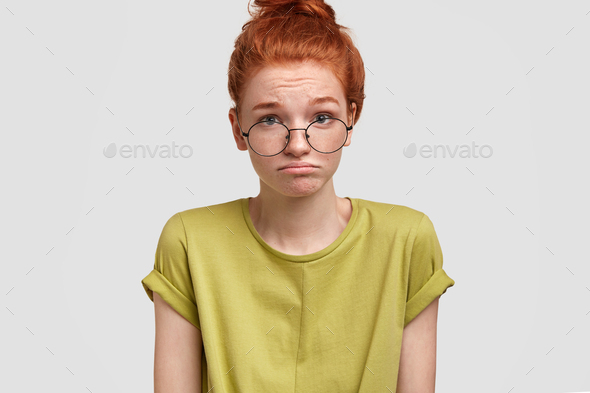 Horizontal portrait of upset college student looks with sullen ...